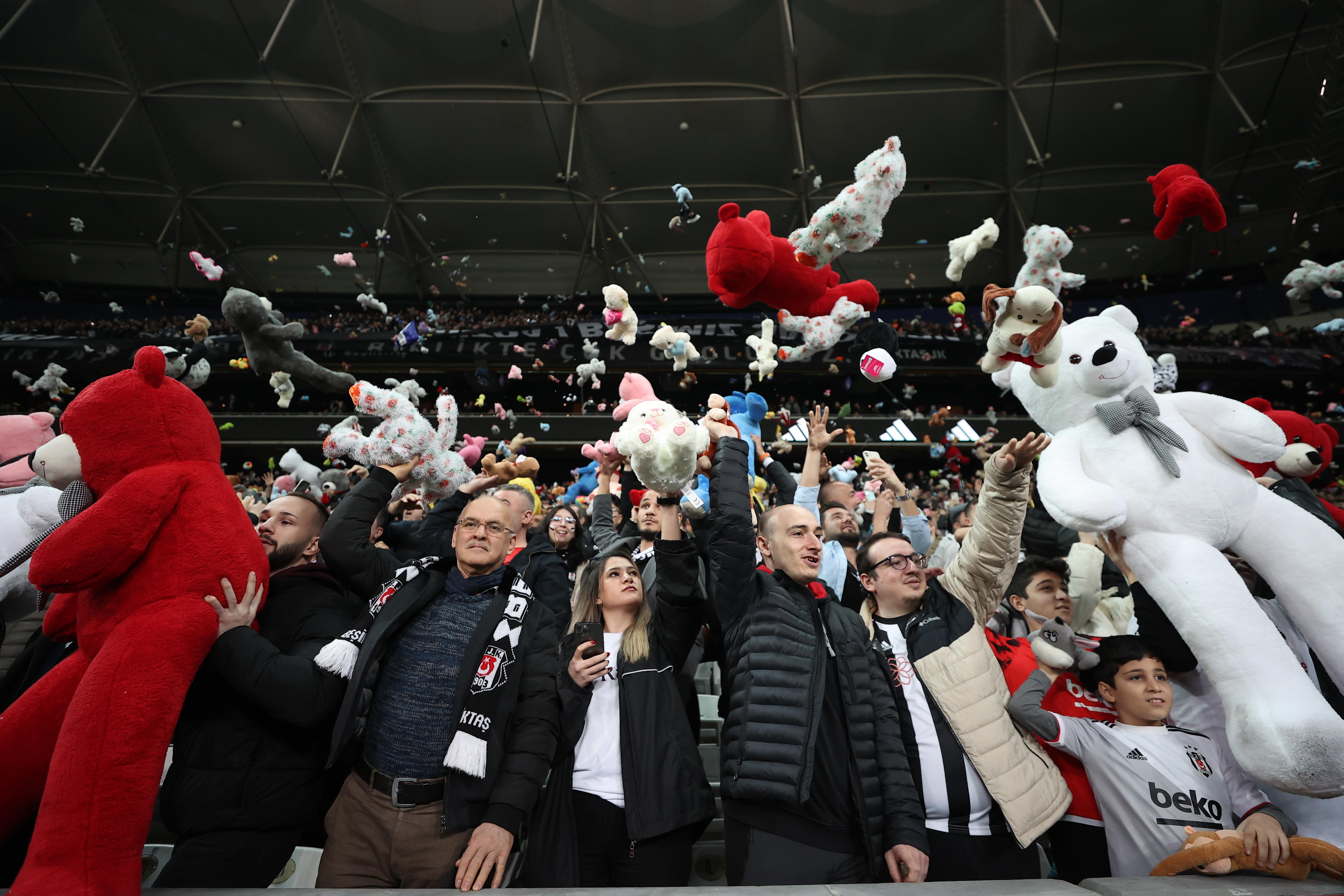 Turkish football fans shower pitch with thousands of toys for ...